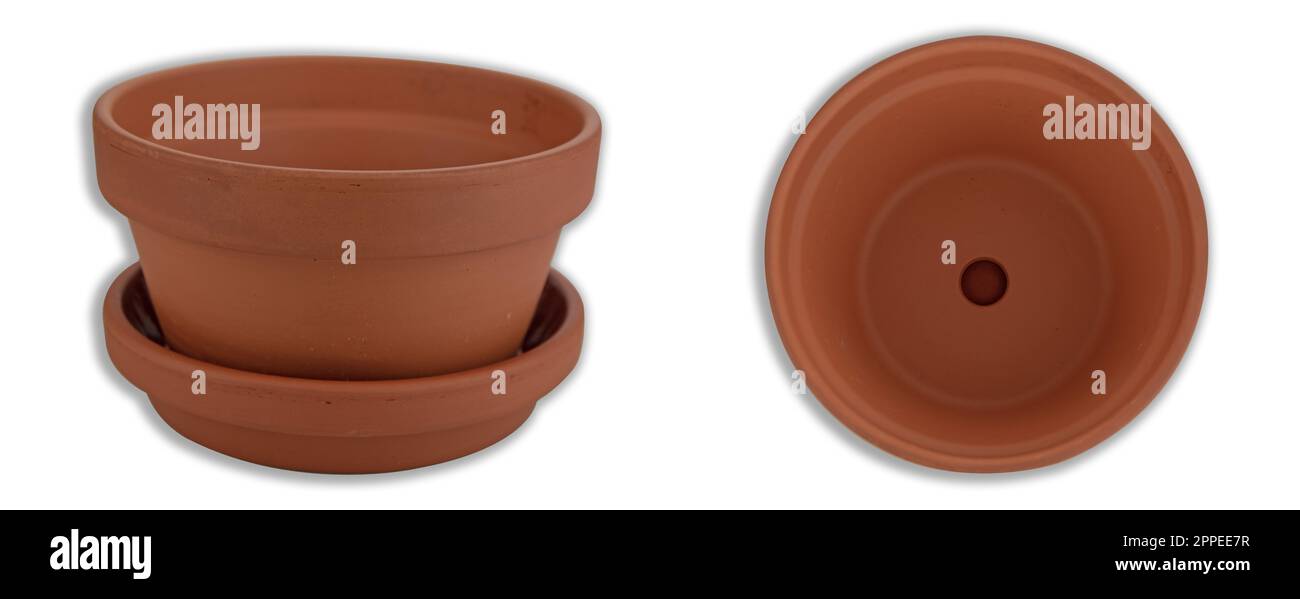 Single brown clay flower pot with saucer isolated on a white background ...