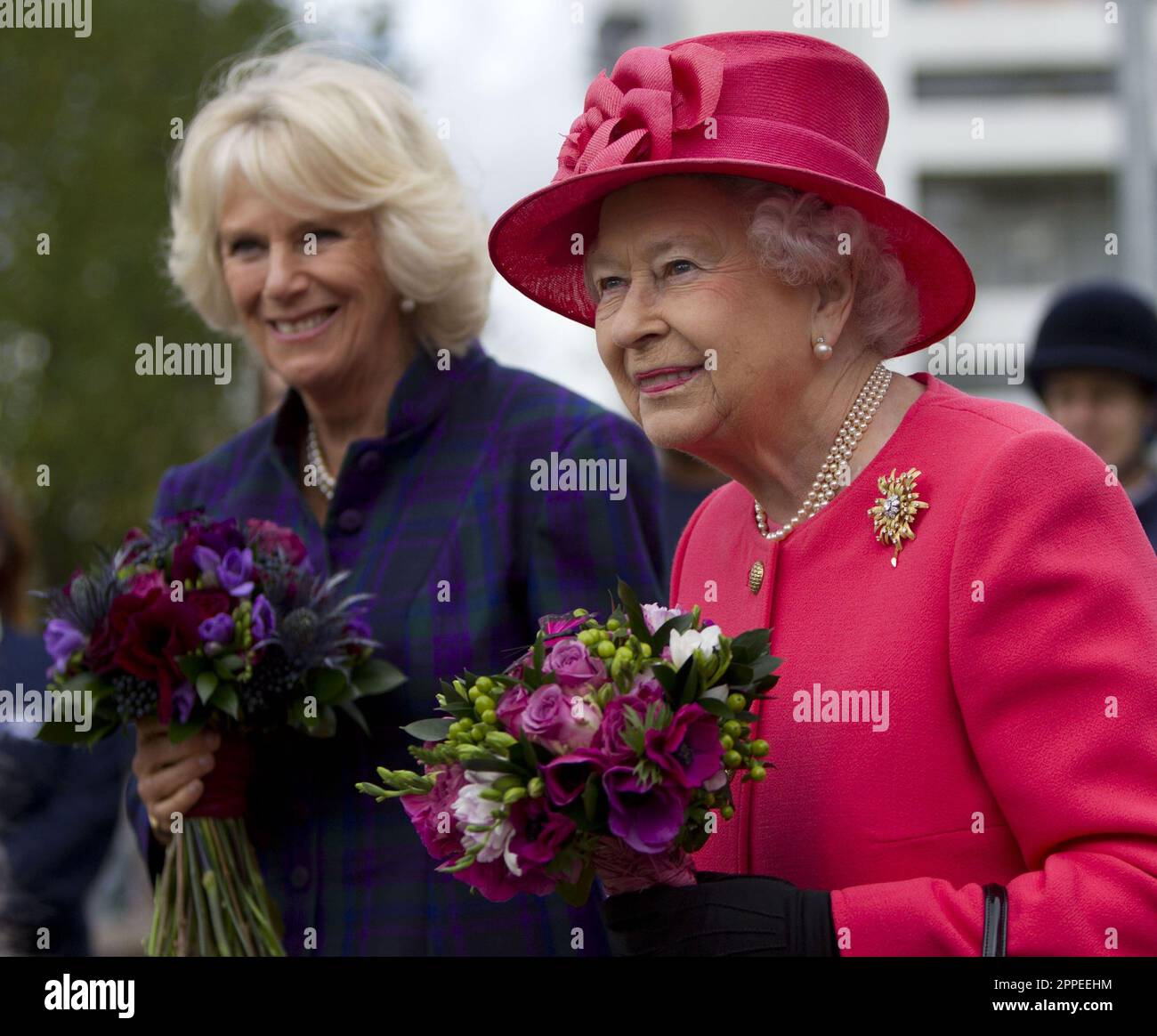 File photo dated 29/10/13 of Queen Elizabeth II, accompanied by the ...