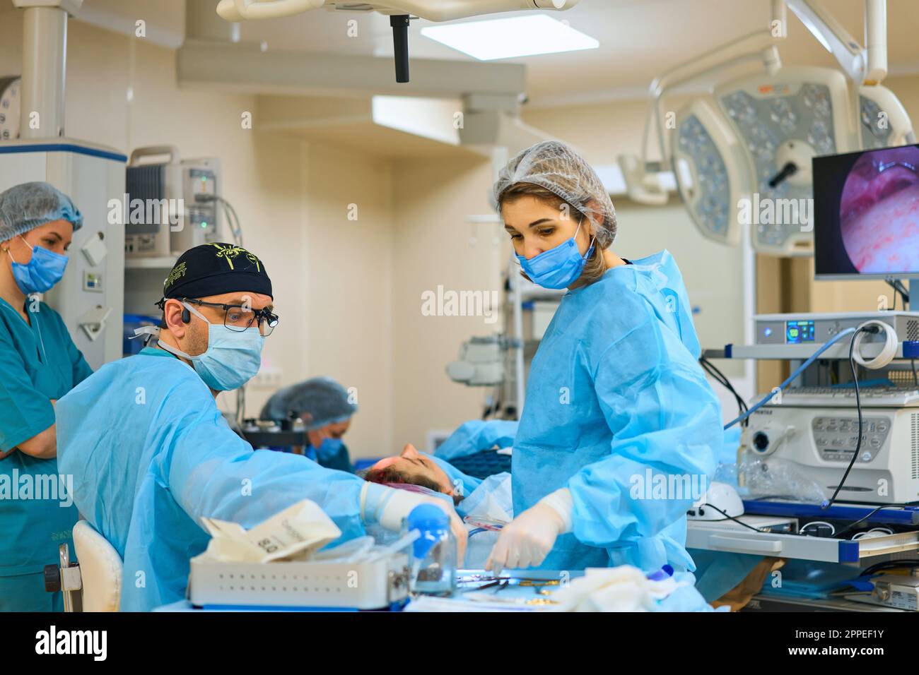 plastic surgeon operates on a patient in the operating room Stock Photo ...