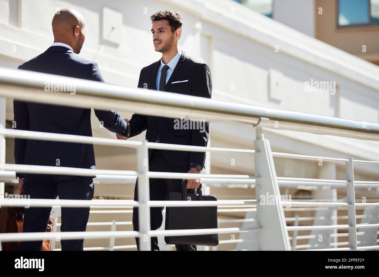 Creating new business ventures by joining together. young handsome ...