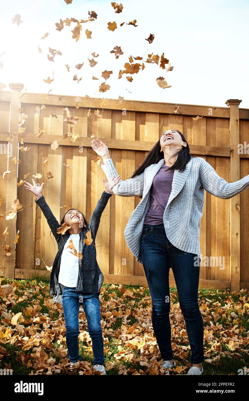 Fall is a feast for all the senses. an adorable little girl enjoying an autumn day outdoors ...