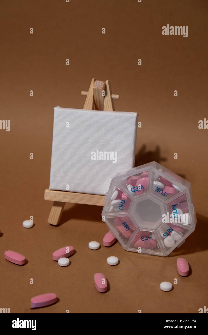 Closeup of medical pill box with doses of tablets for daily take ...