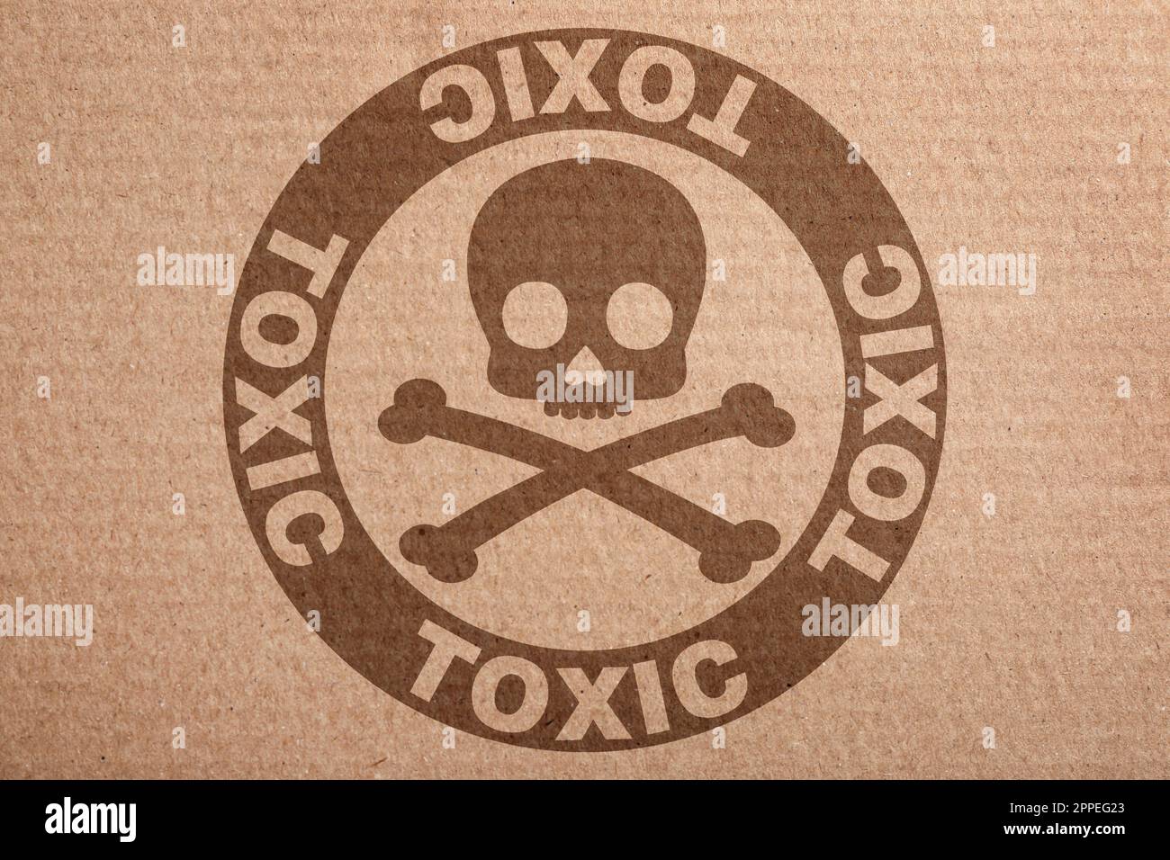 Hazard warning sign (skull-and-crossbones symbol and word TOXIC) on ...