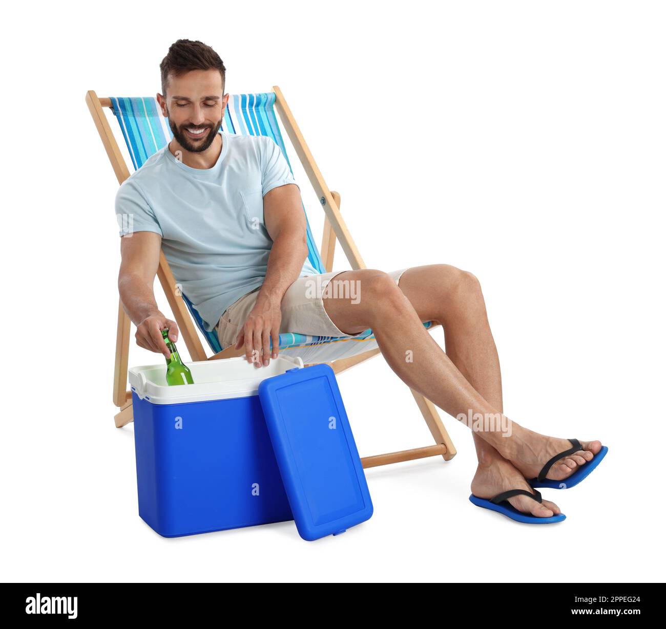 Happy man taking bottle of beer from cool box on white background Stock ...