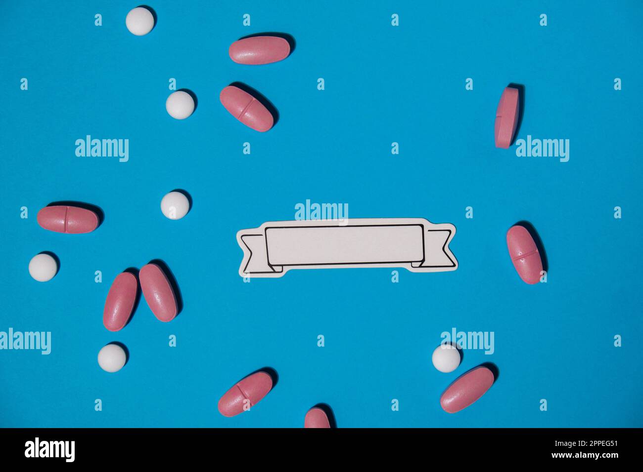 Closeup of doses of tablets for daily take medicine with white pink ...
