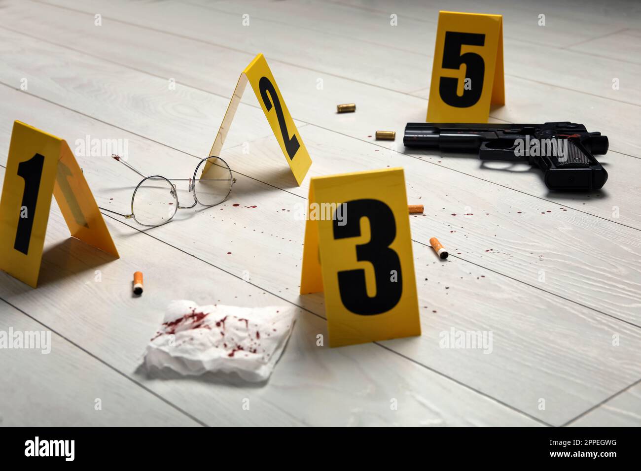 Evidences and crime scene marker on white wooden table Stock Photo - Alamy