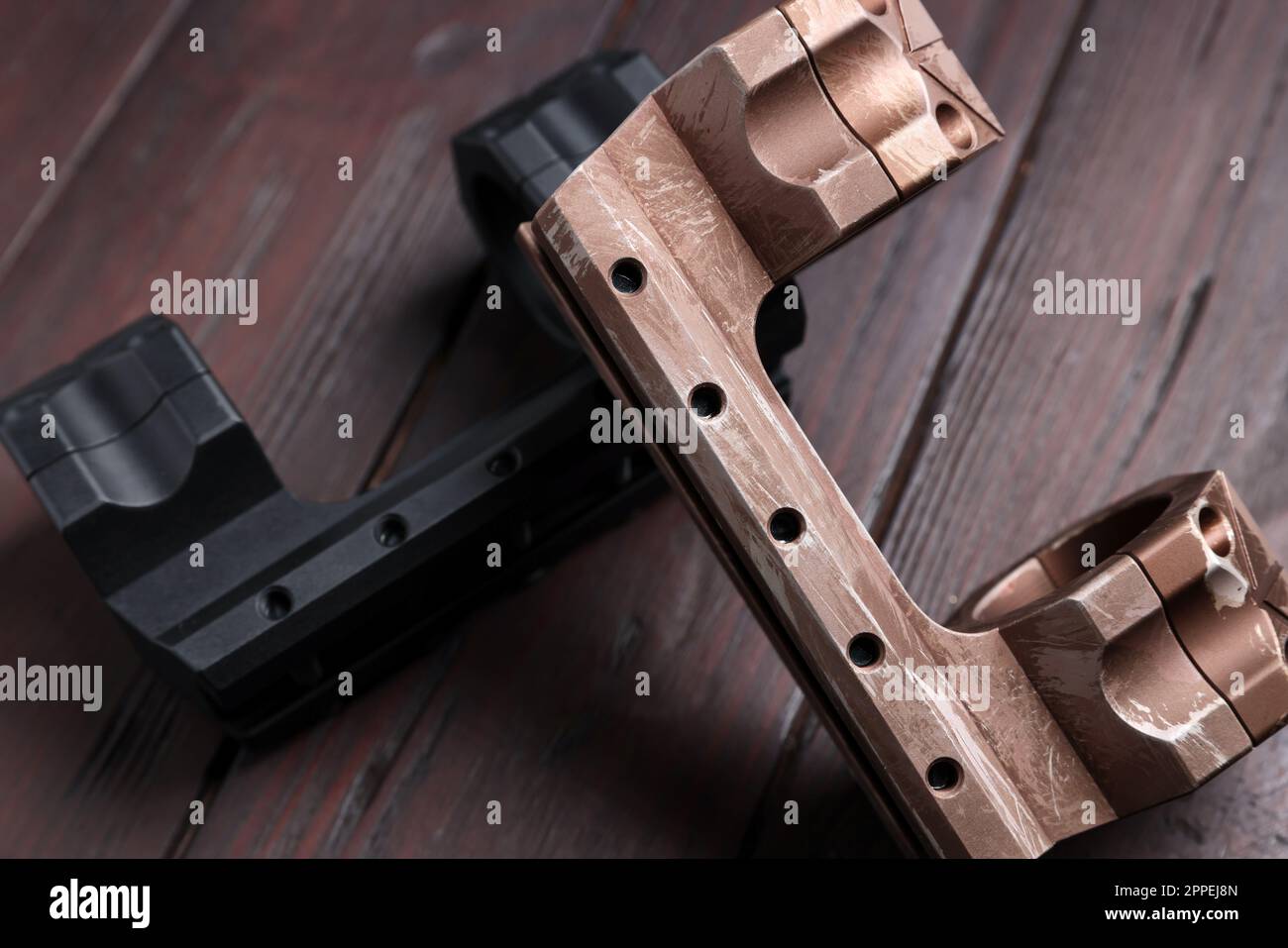 Quick disconnect sniper cantilever scope mounts on wooden table ...