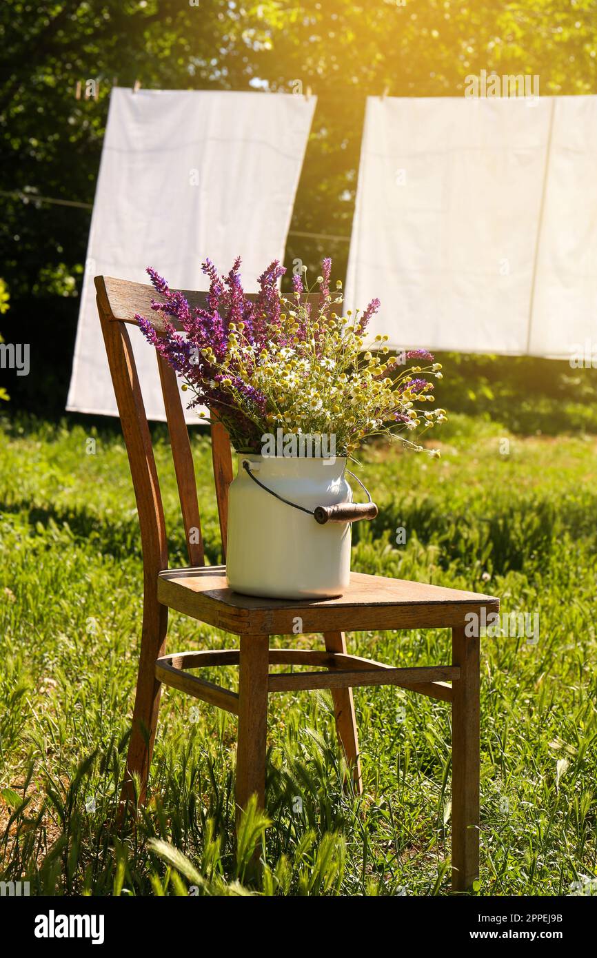 Flowers on chair hi-res stock photography and images - Alamy