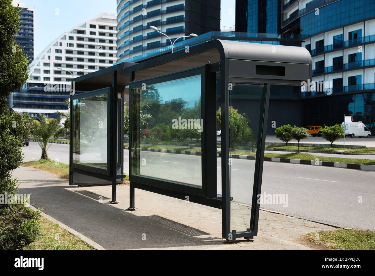Modern public transport stop on city street Stock Photo - Alamy