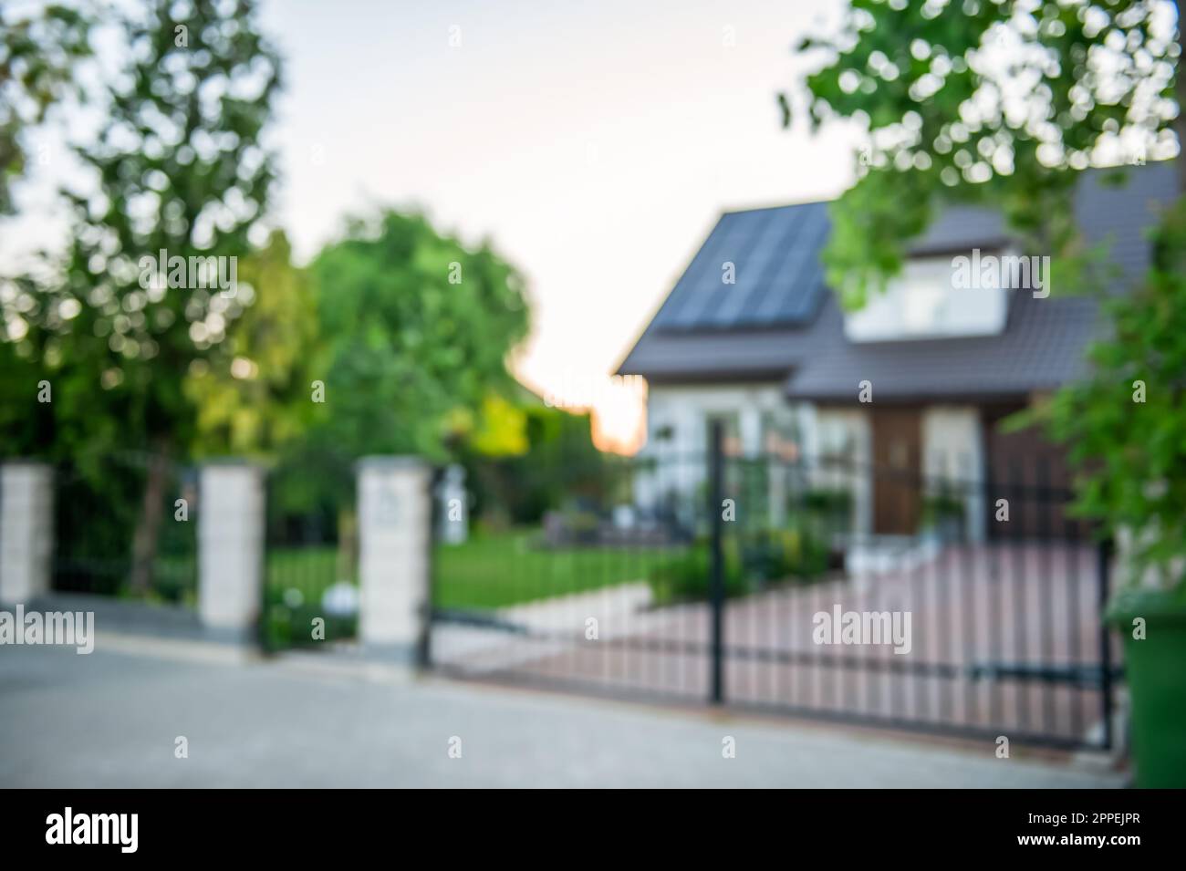House behind green gates hi-res stock photography and images - Alamy