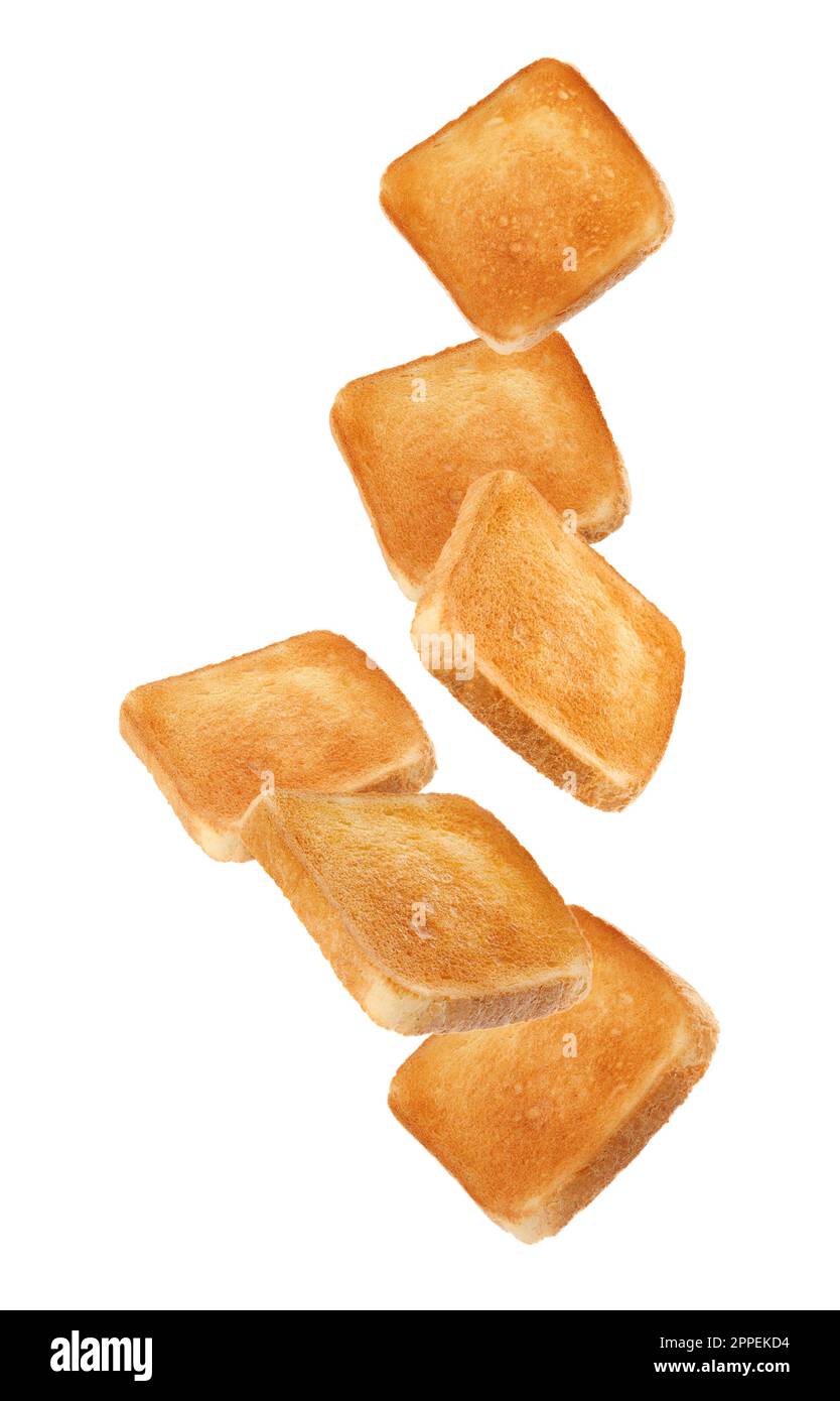 Slices of tasty toasted bread falling on white background Stock Photo ...