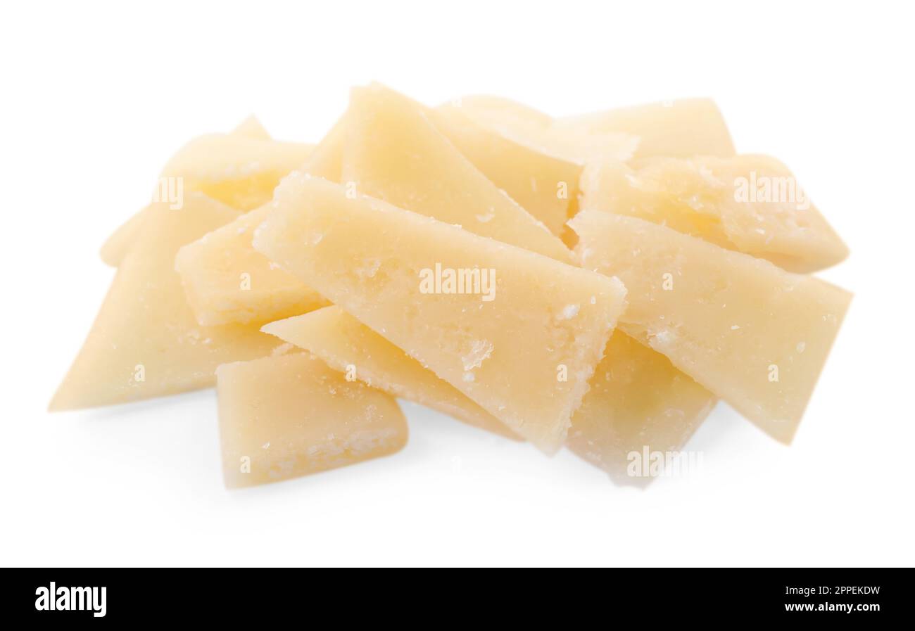 Pile of parmesan cheese pieces on white background Stock Photo - Alamy