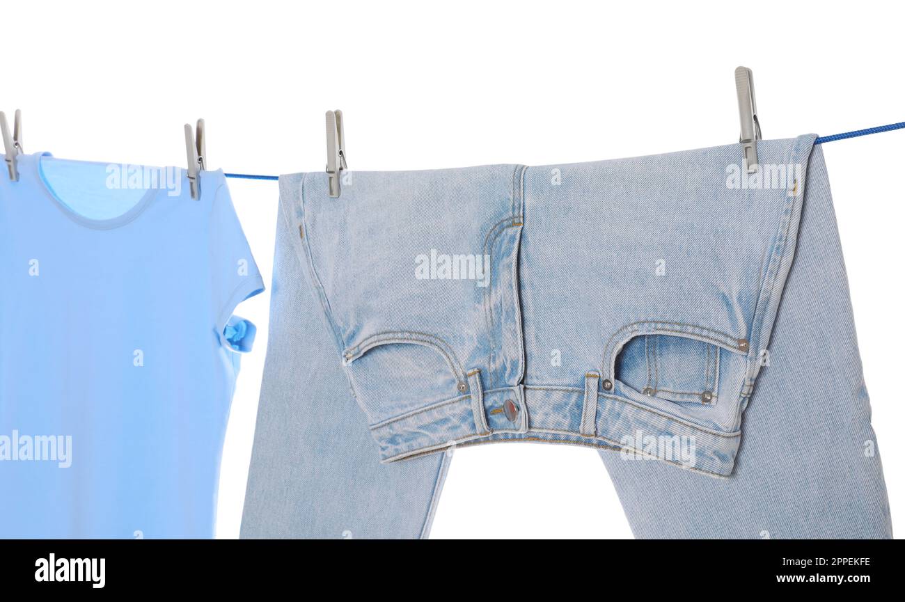 Clothes drying on washing line against white background Stock Photo - Alamy