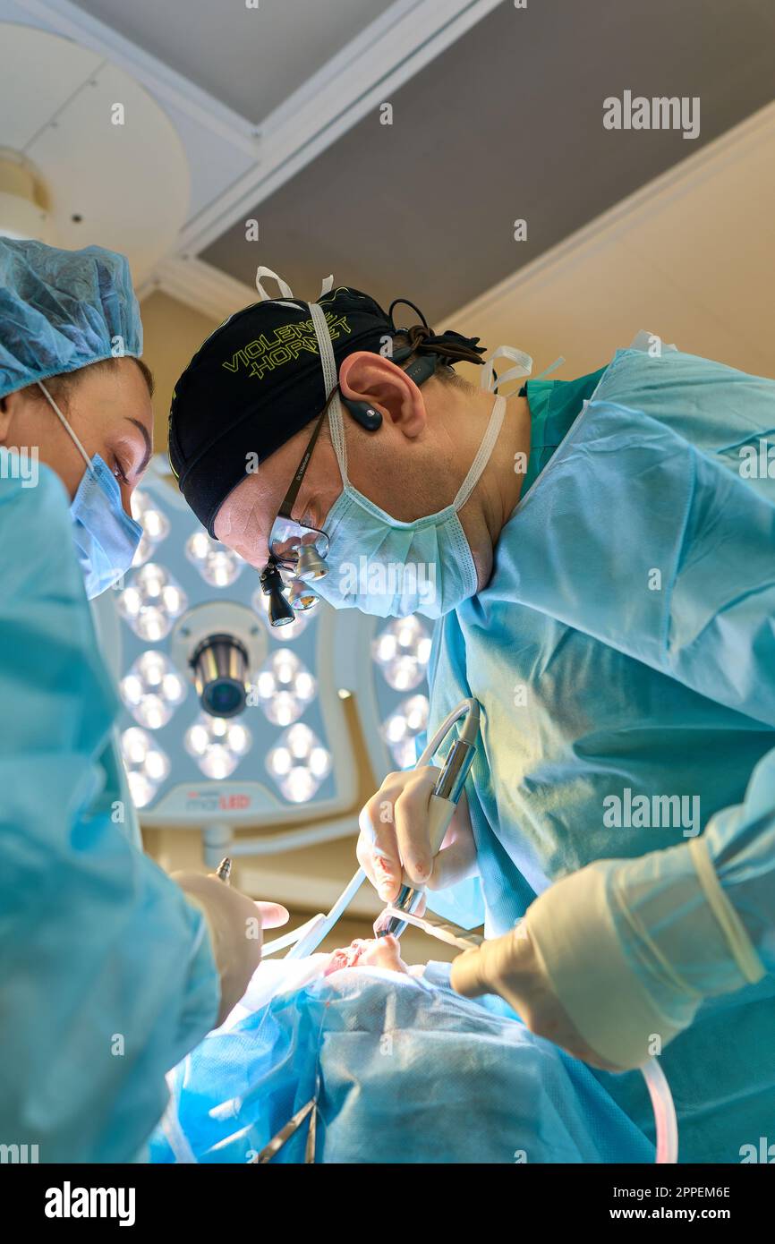 plastic surgeon operates on a patient in the operating room Stock Photo ...