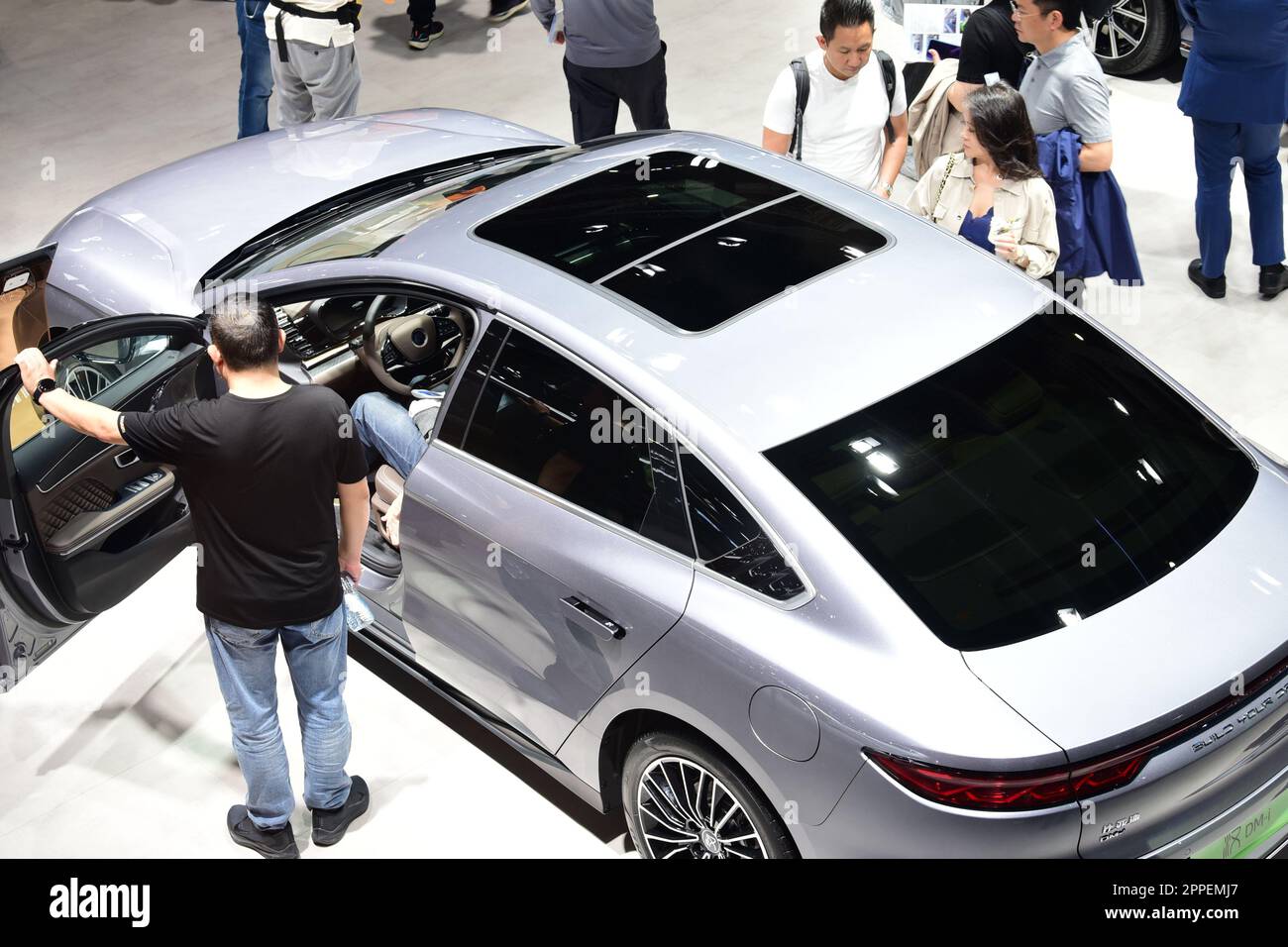 SHANGHAI, CHINA - APRIL 21, 2023 - A crowd gathers at the stand of ...