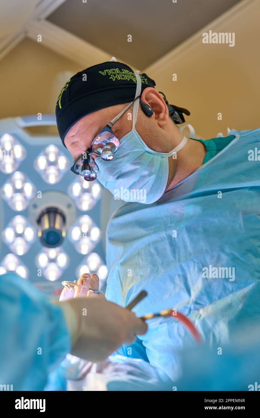 plastic surgeon operates on a patient in the operating room Stock Photo ...