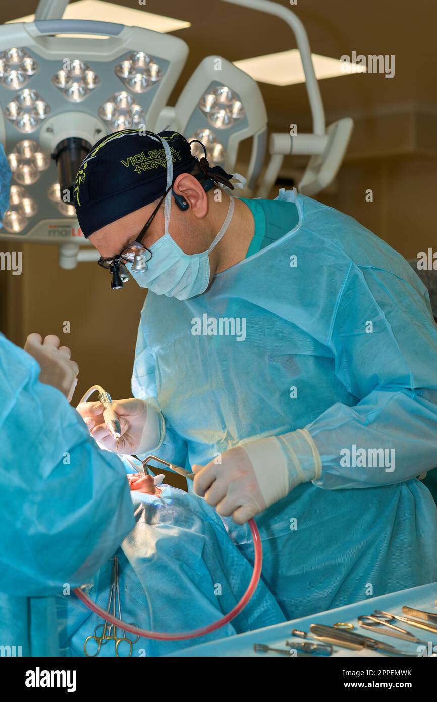 plastic surgeon operates on a patient in the operating room Stock Photo ...