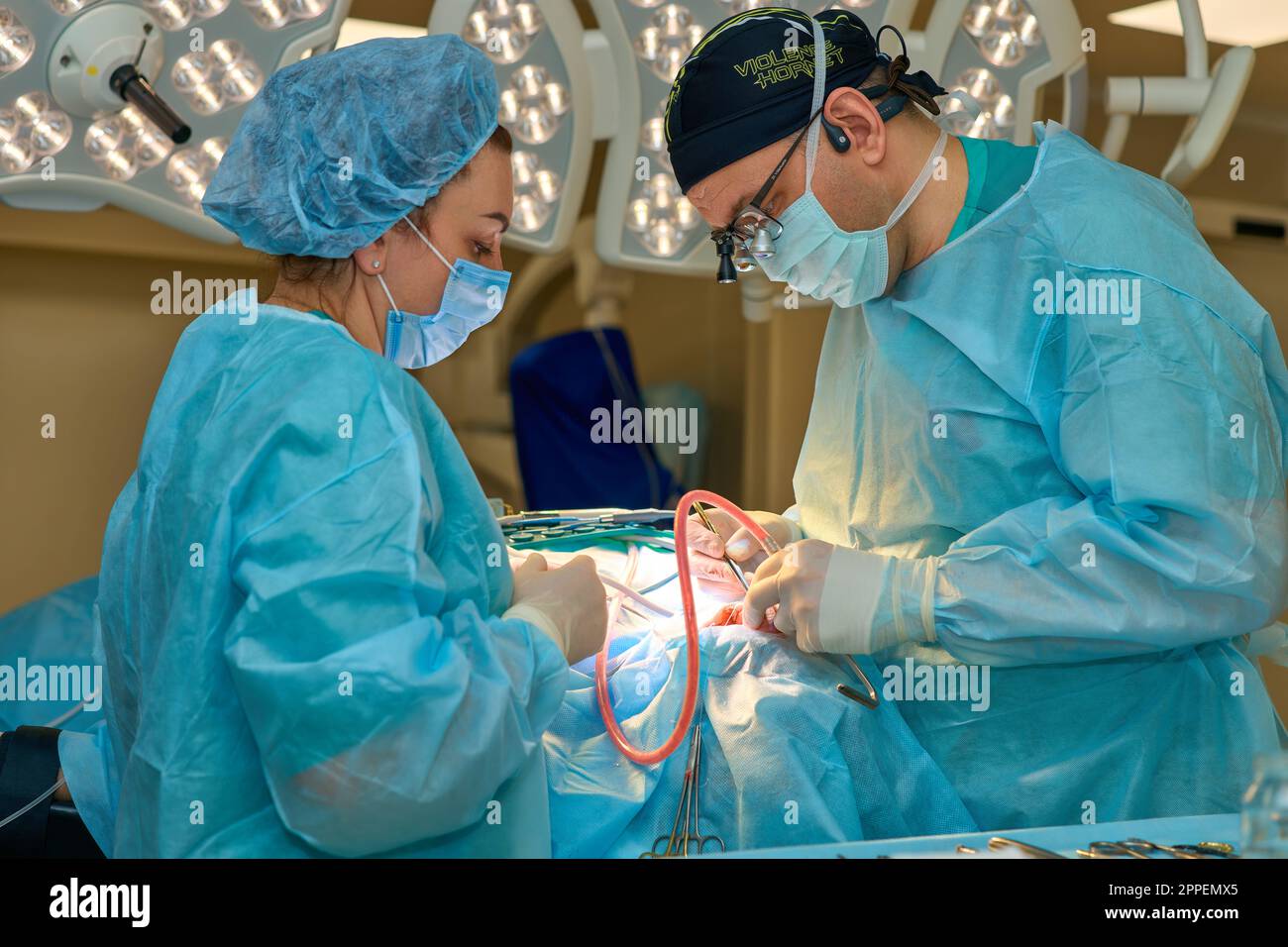 plastic surgeon operates on a patient in the operating room Stock Photo ...