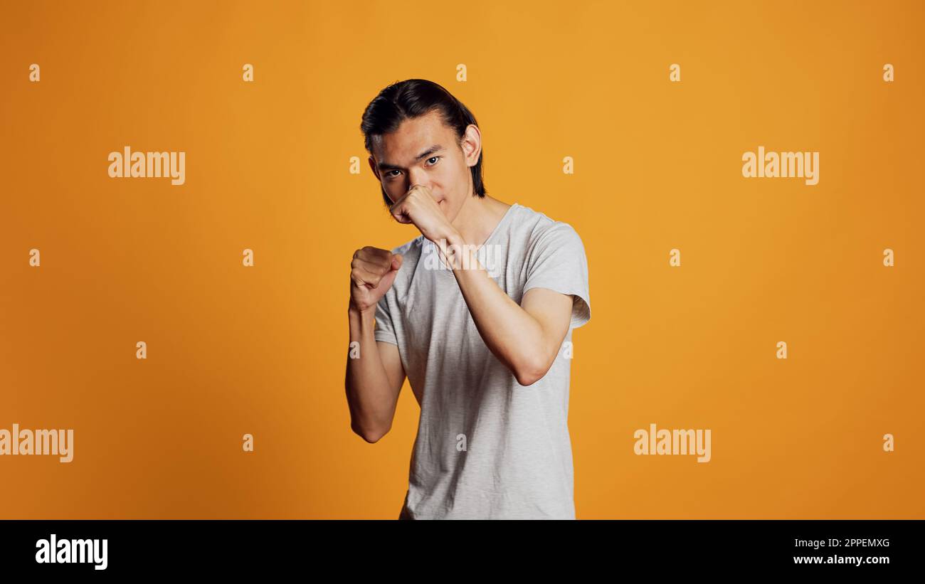 Male model having argument and acting violent, being furious and ...