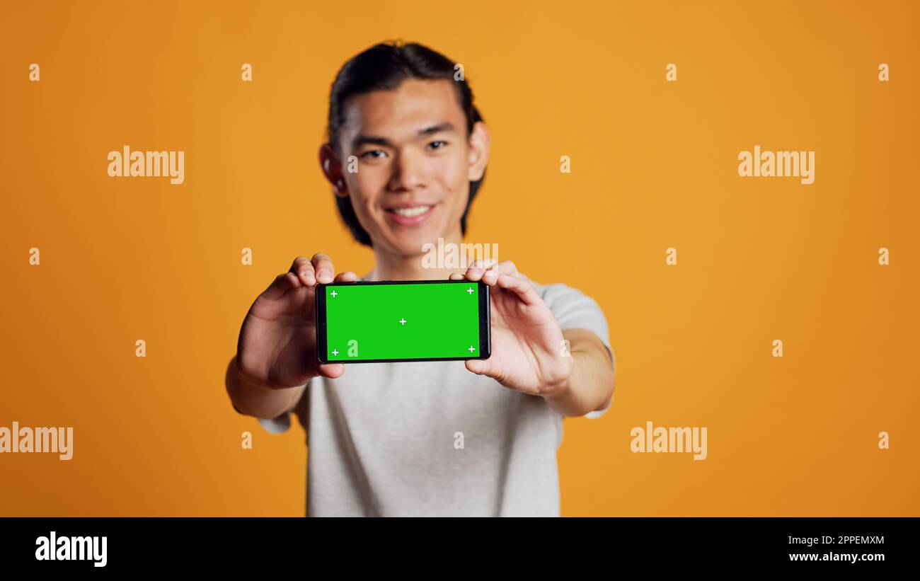 Positive man using greenscreen display hi-res stock photography and ...