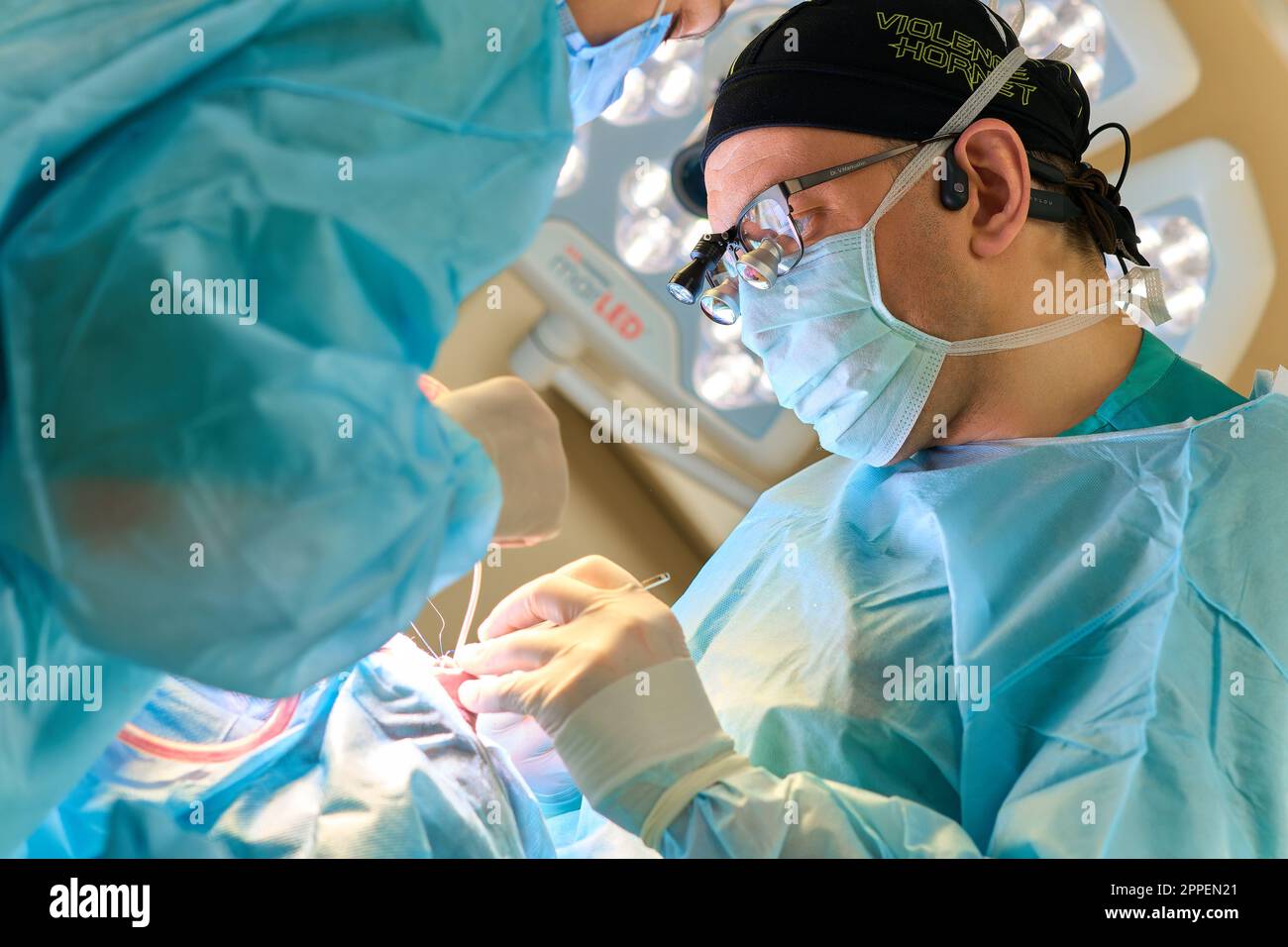 plastic surgeon operates on a patient in the operating room Stock Photo ...