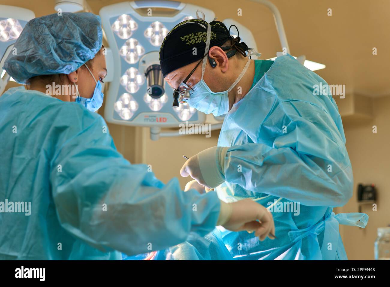 plastic surgeon operates on a patient in the operating room Stock Photo ...