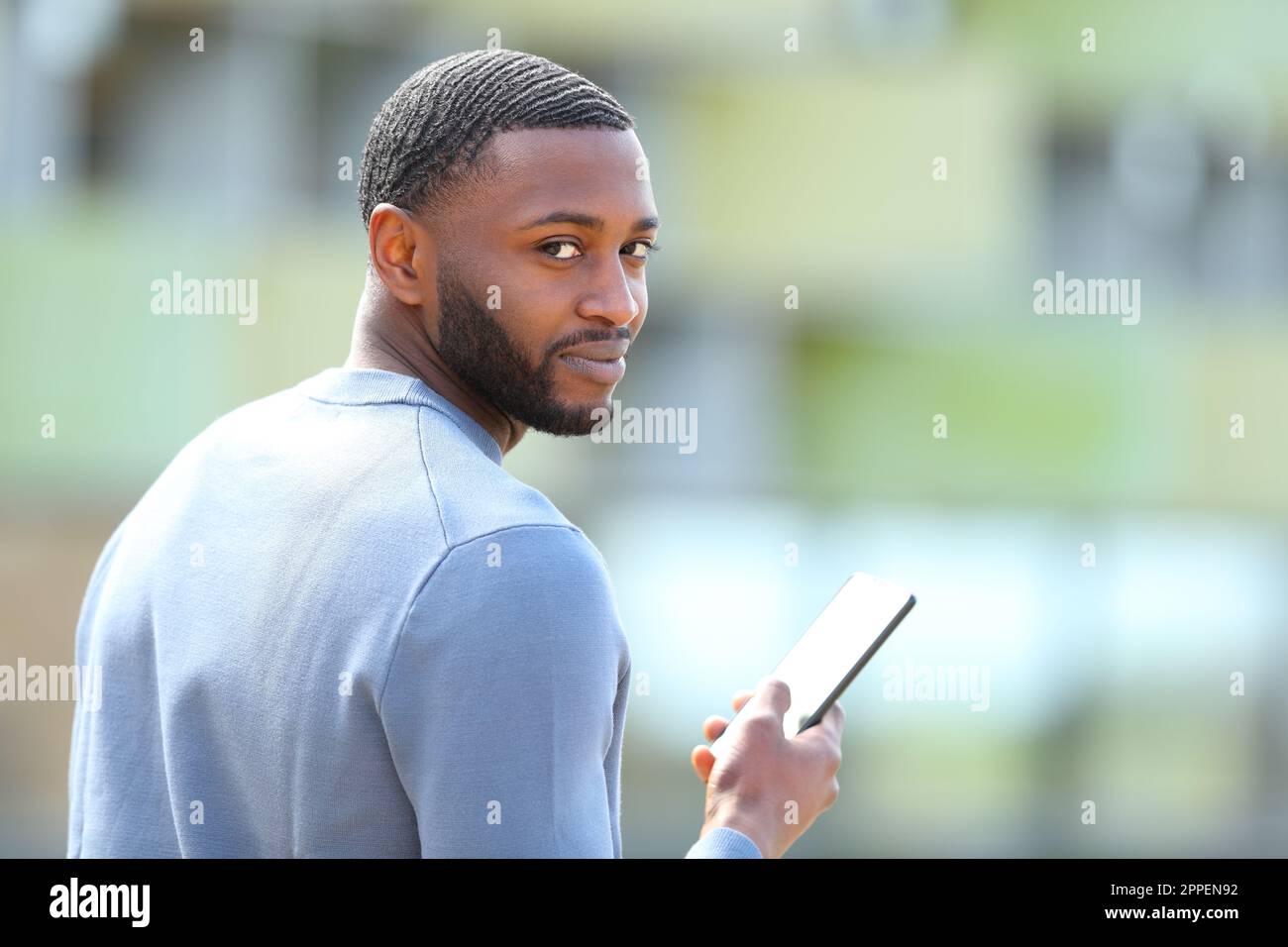 Hand holding phone back hi-res stock photography and images - Alamy