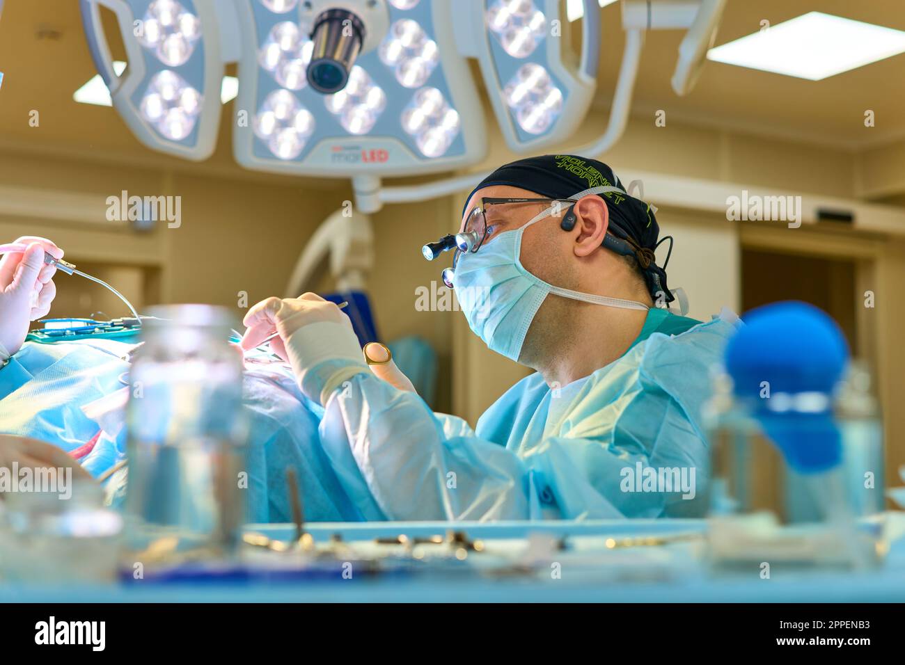 plastic surgeon operates on a patient in the operating room Stock Photo ...