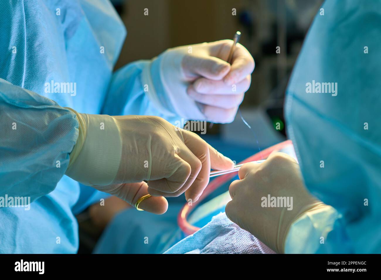 surgical instruments in the hands of a doctor close-up Stock Photo - Alamy