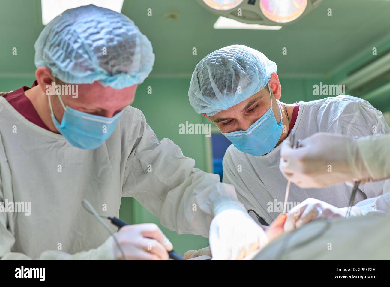 plastic surgeon operates on a patient in the operating room Stock Photo ...
