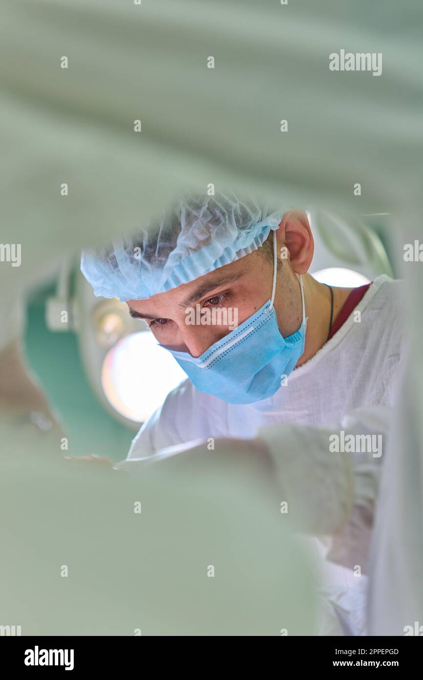 plastic surgeon operates on a patient in the operating room Stock Photo ...