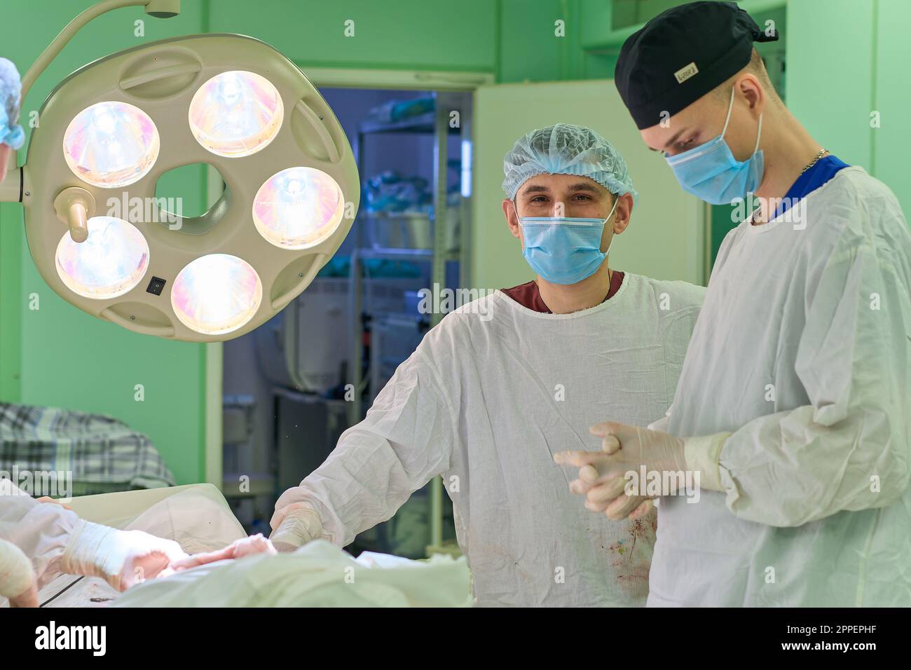 plastic surgeon operates on a patient in the operating room Stock Photo ...