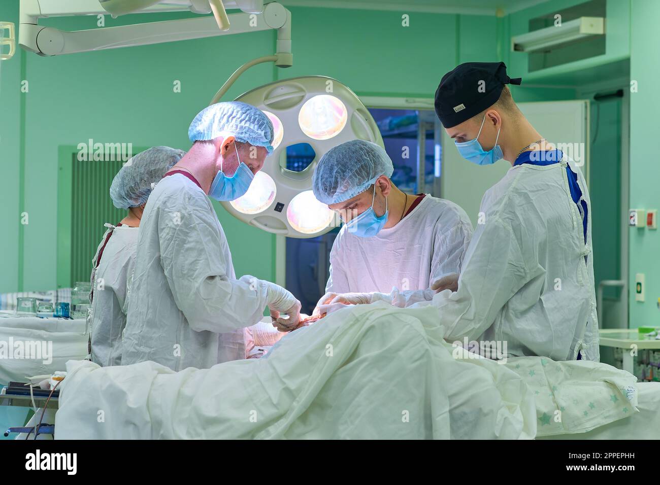 plastic surgeon operates on a patient in the operating room Stock Photo ...