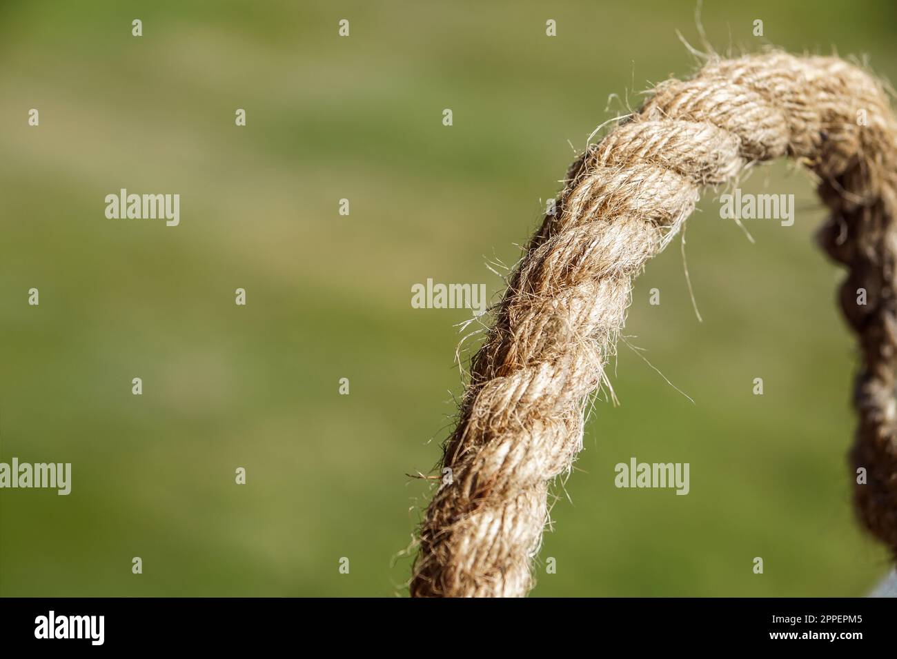 straw rope knot isolated on green background Stock Photo - Alamy