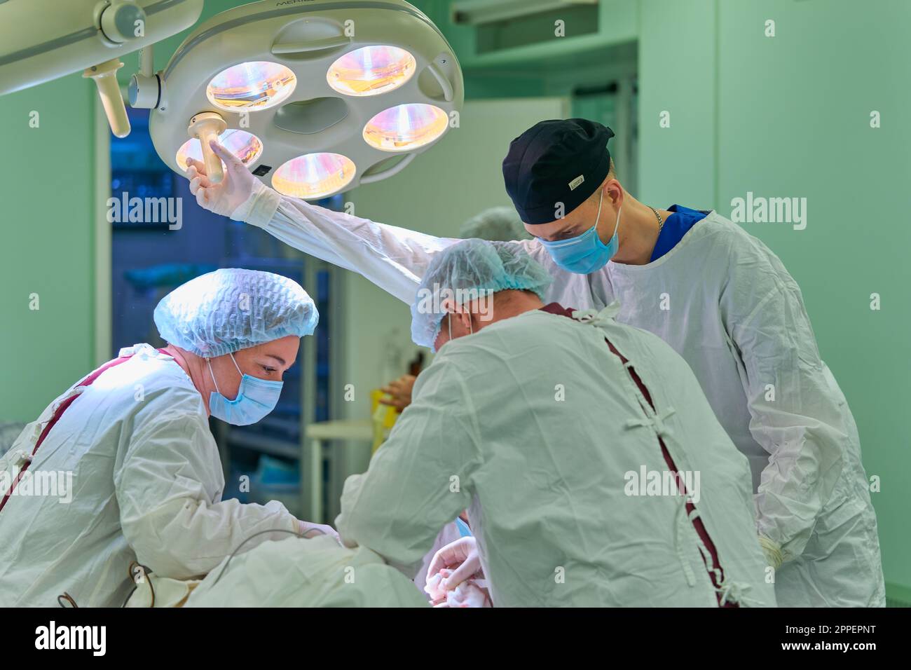 plastic surgeon operates on a patient in the operating room Stock Photo ...
