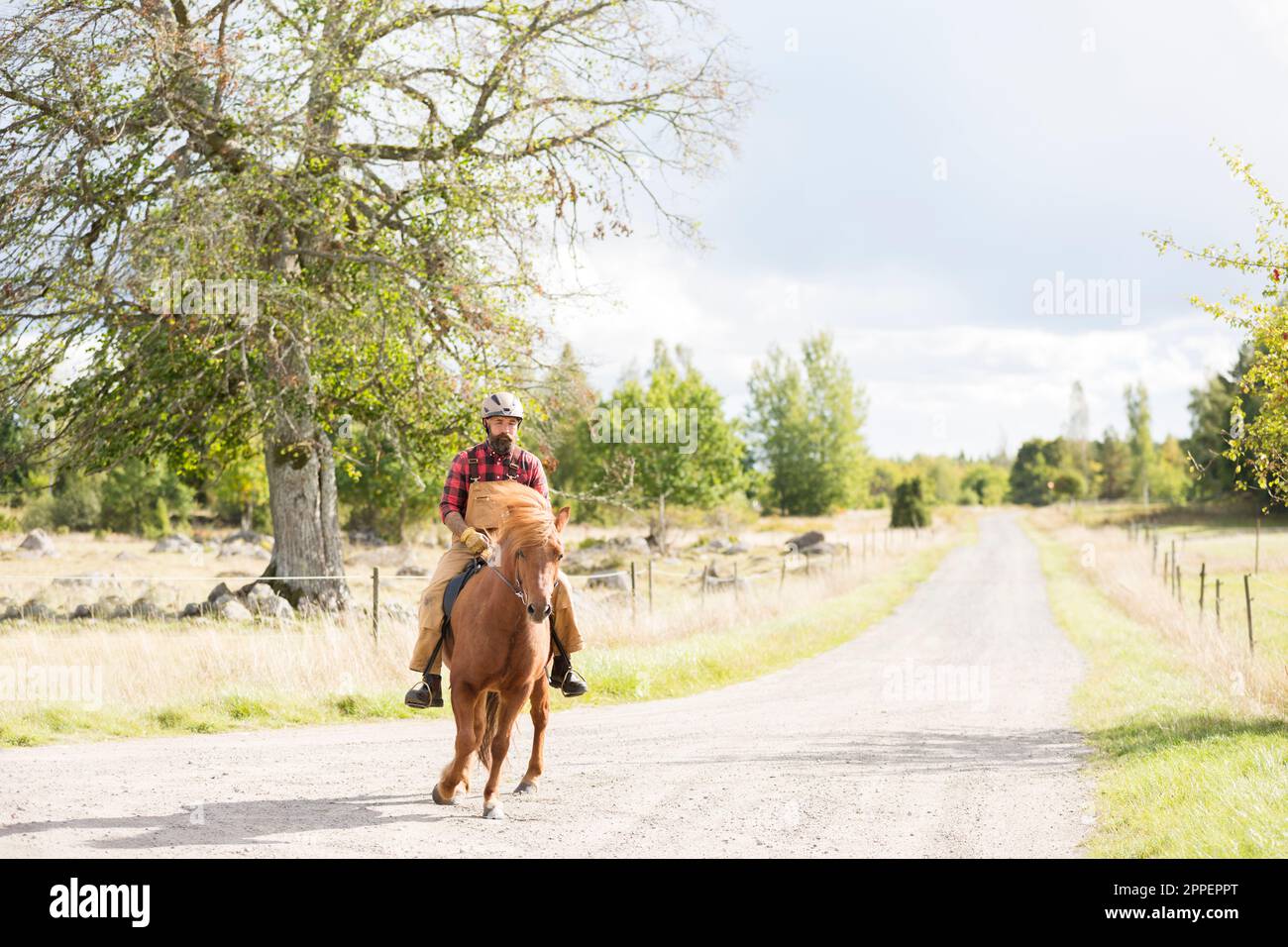 Farmer riding horse hi-res stock photography and images - Alamy