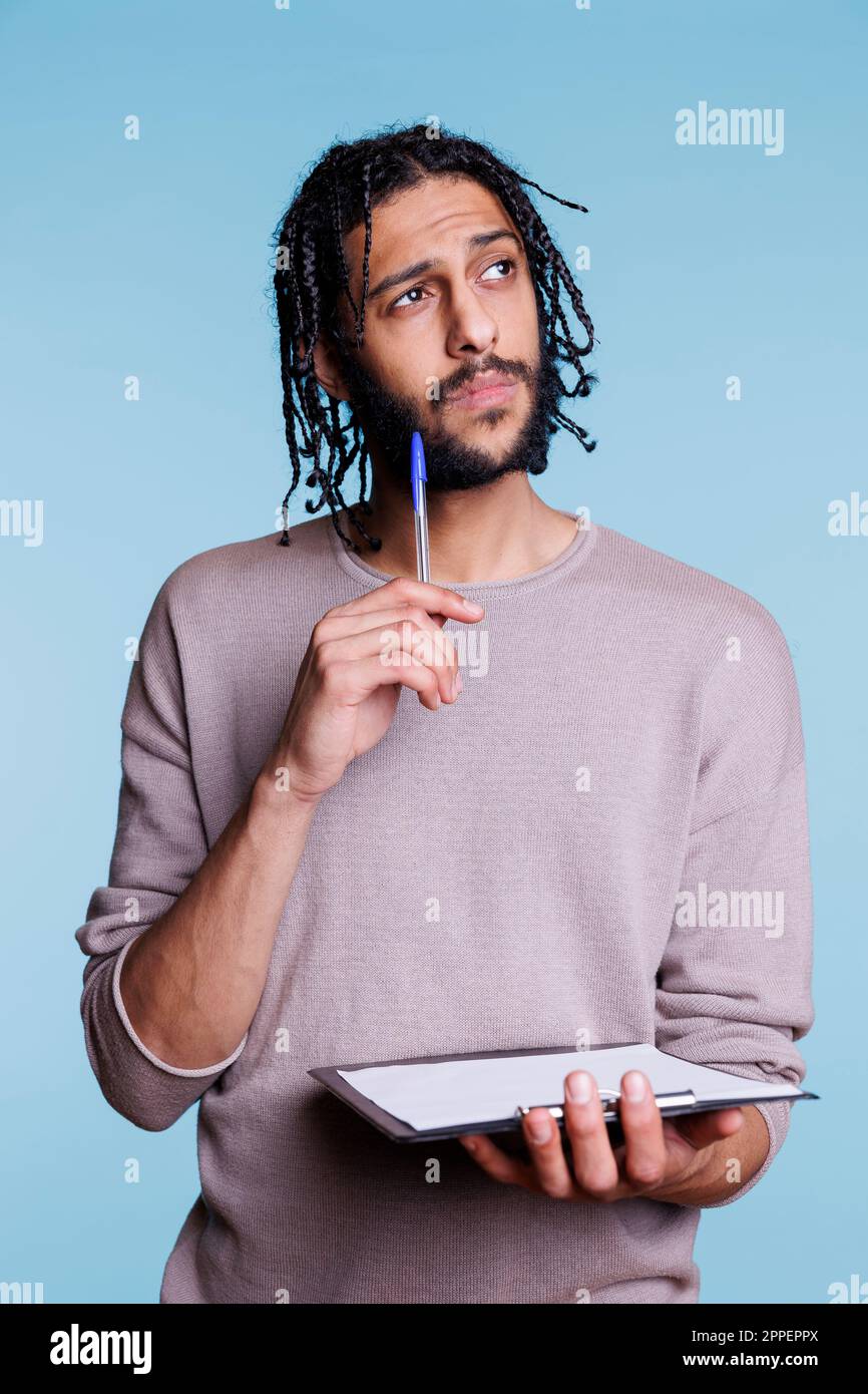 Arab man holding pen hi-res stock photography and images - Alamy