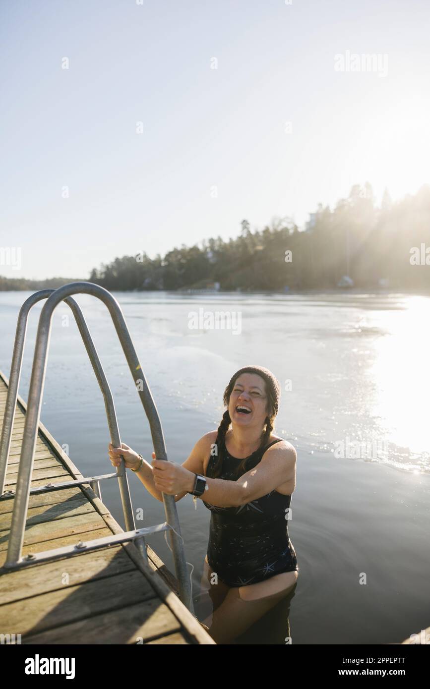Woman cold water swimming lake hi-res stock photography and images - Alamy