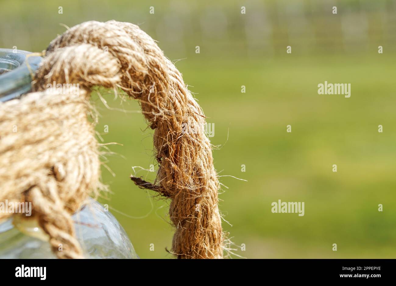 straw rope knot isolated on green background Stock Photo - Alamy