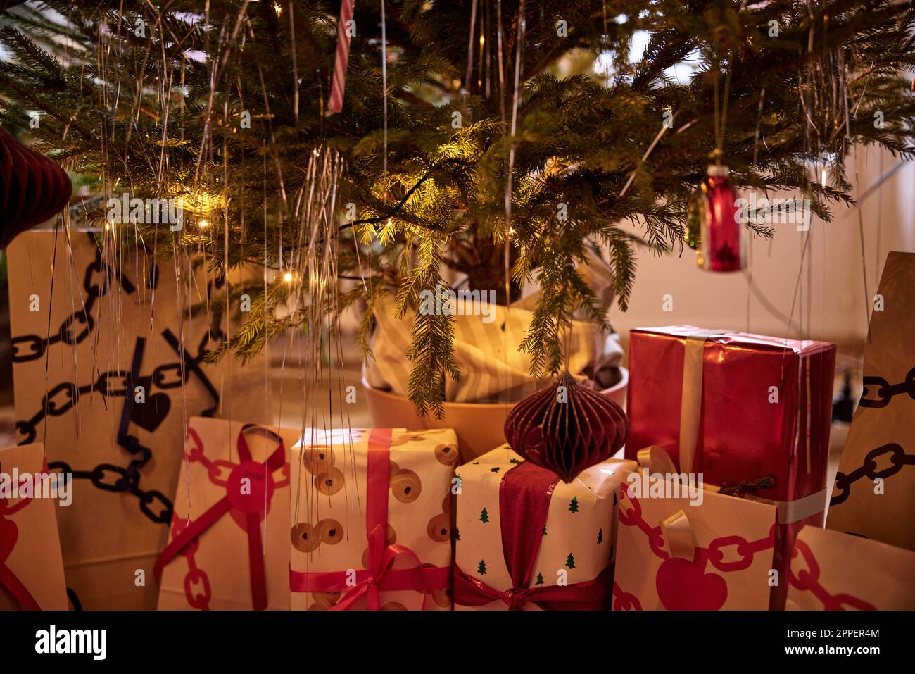 Christmas presents under Christmas tree Stock Photo - Alamy