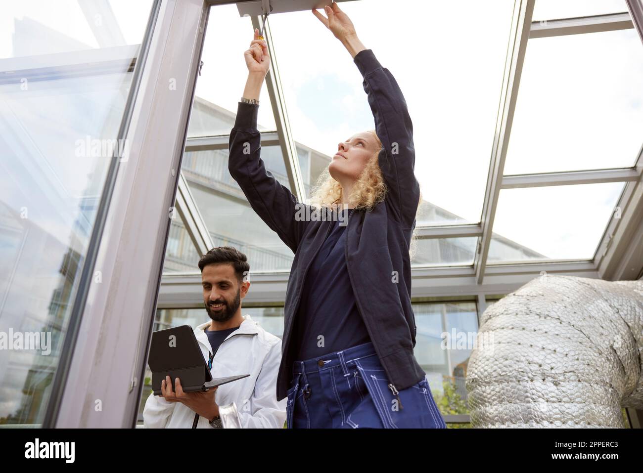 Man and woman working together Stock Photo - Alamy