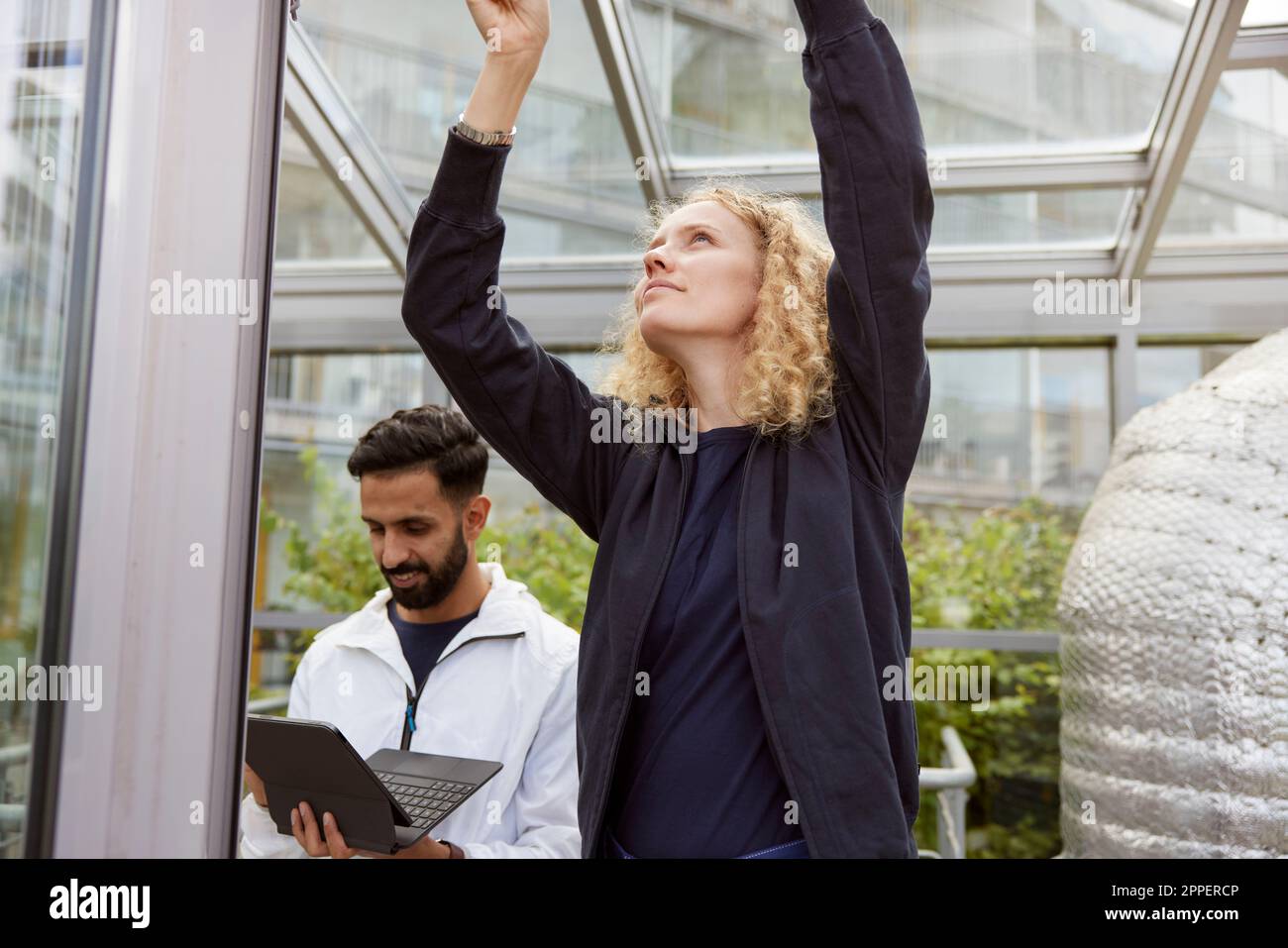 Man and woman working together Stock Photo - Alamy