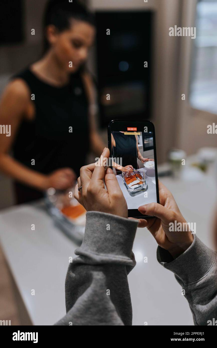 Hand taking photos with cell phone Stock Photo - Alamy