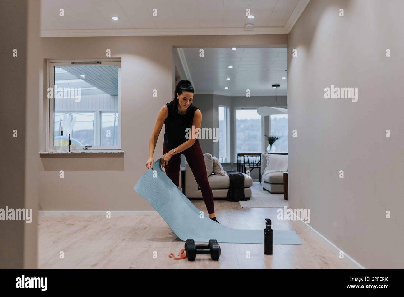 Woman on floor dumbbells exercise hi-res stock photography and images ...