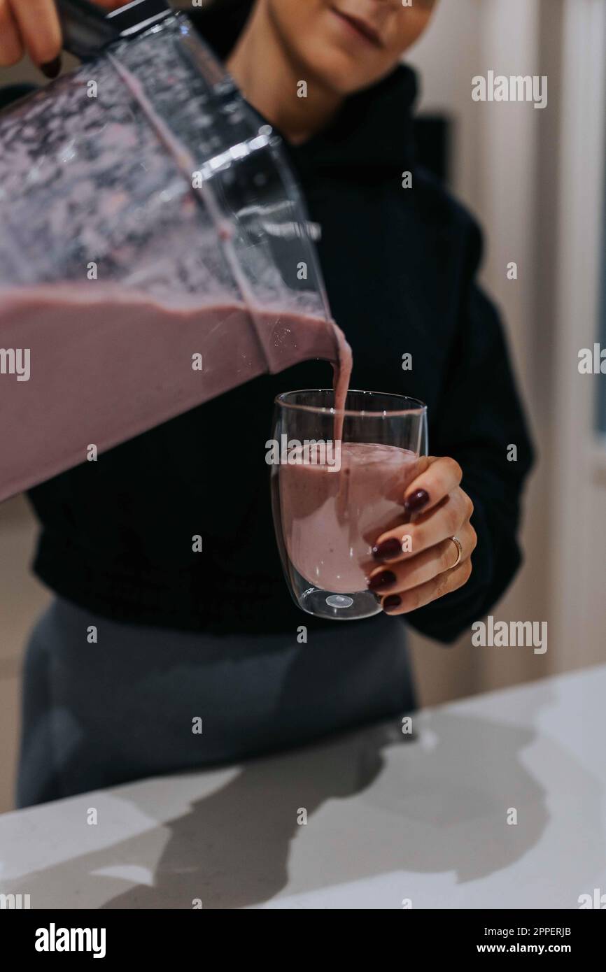 Woman pouring water inside cooking hi-res stock photography and images ...