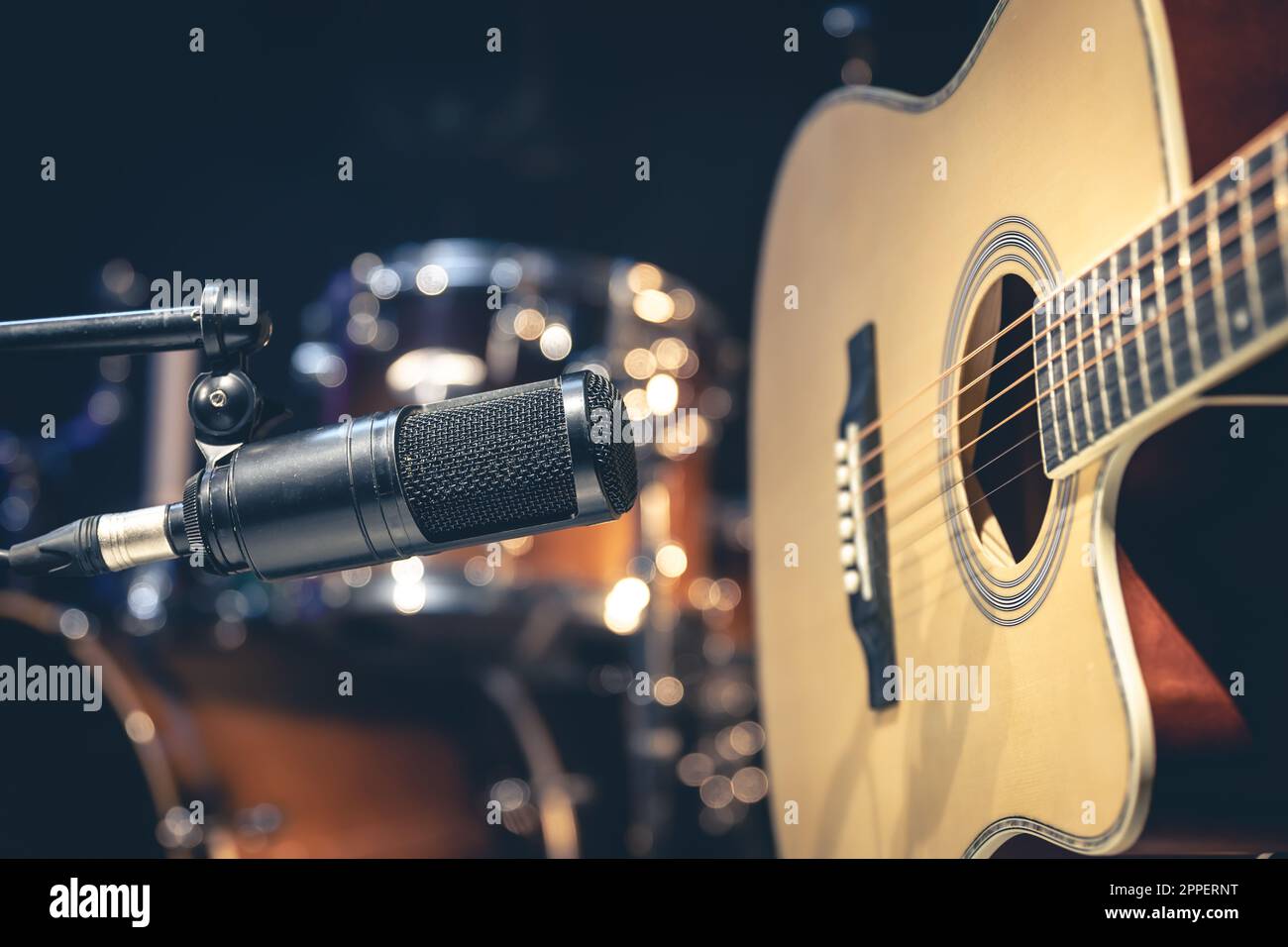 Acoustic guitar and microphone, recording in a music studio Stock Photo ...