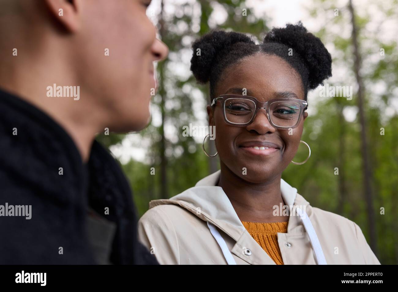 Smiling long haired man talking hi-res stock photography and images - Alamy