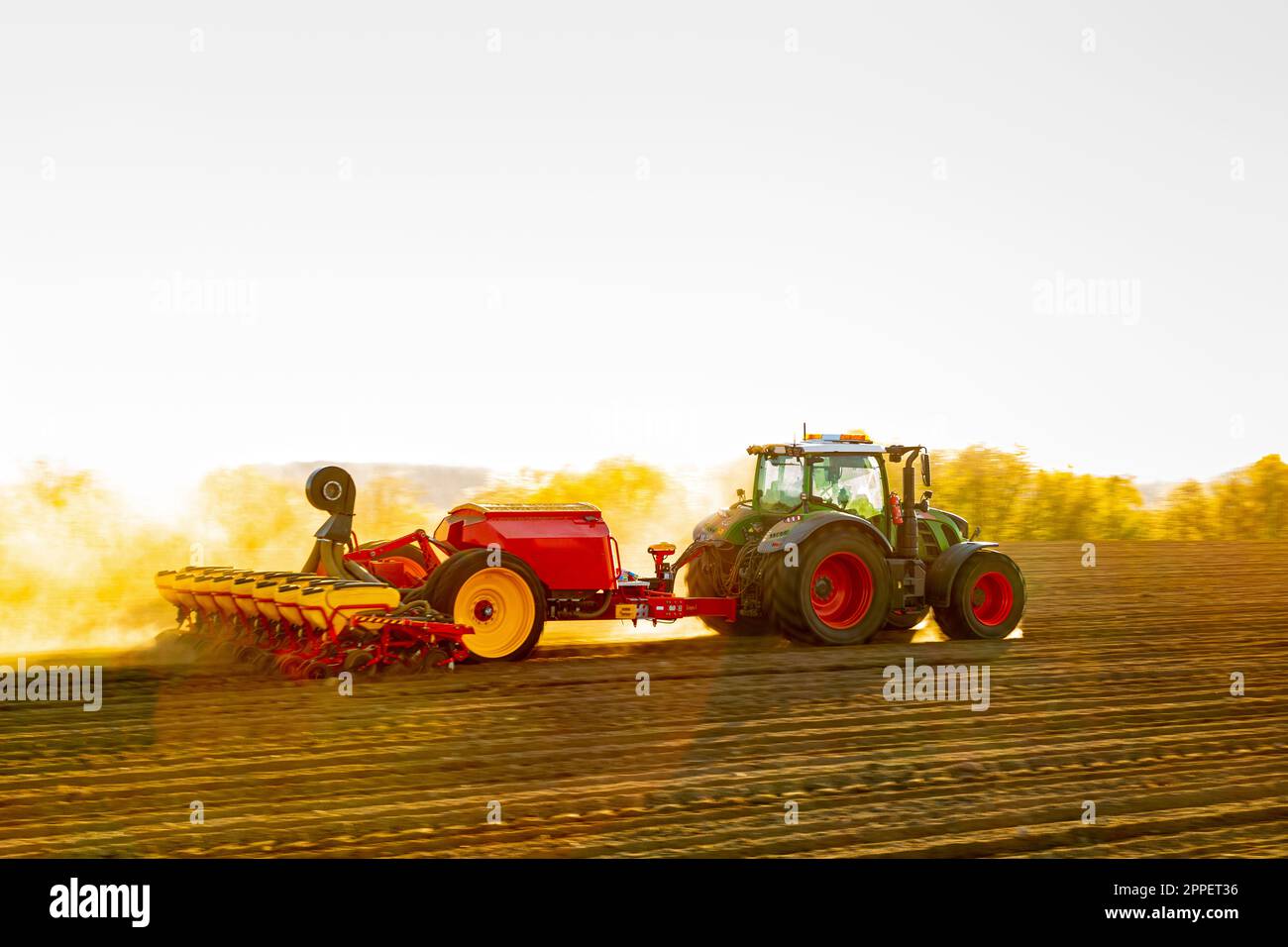 Tractor plowing field at spring Stock Photo - Alamy