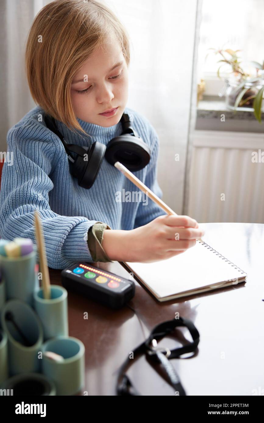 Girl doing homework at home Stock Photo - Alamy