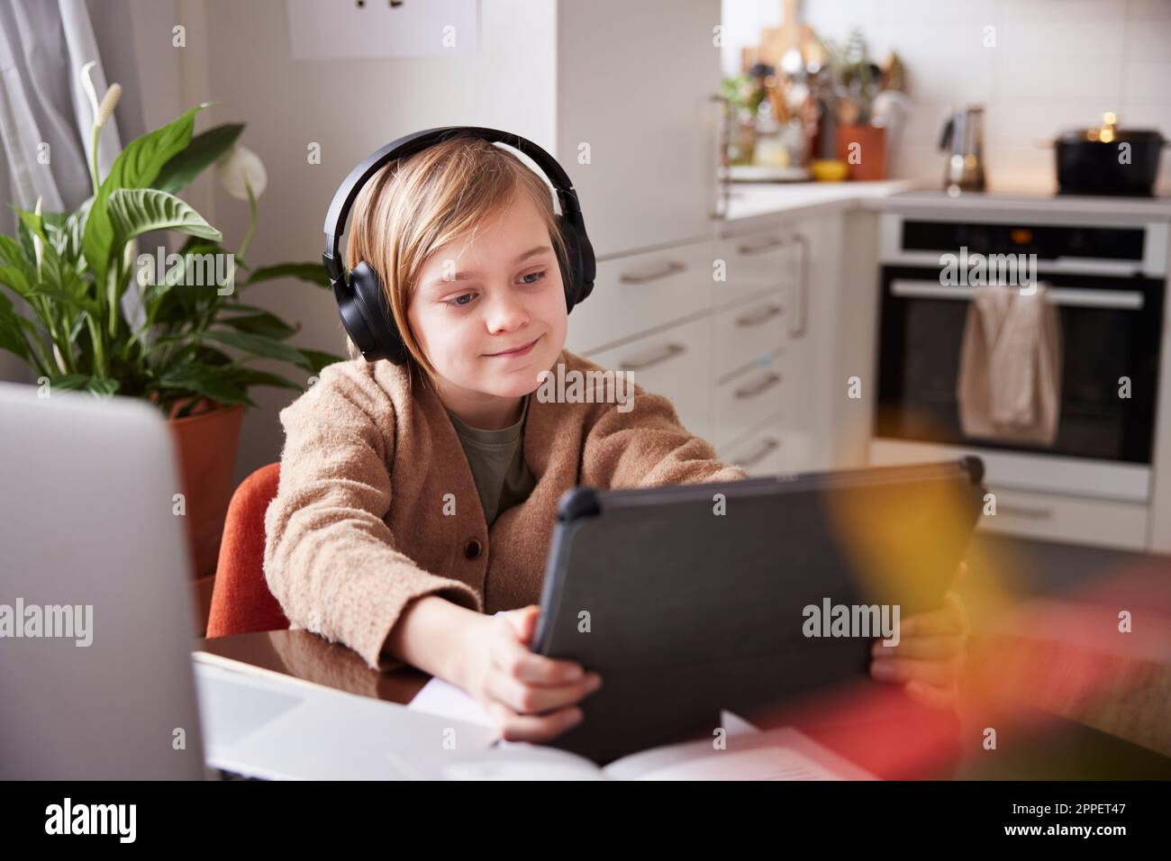 Girl doing homework at home Stock Photo - Alamy